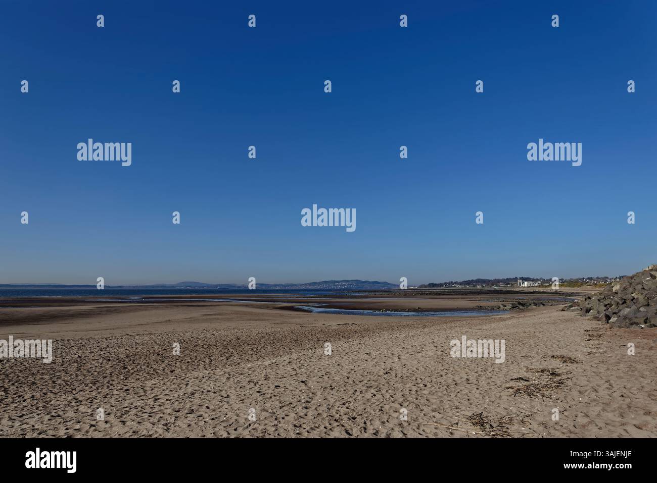 The beach and sea defences at Monifieth looking towards Broughty Ferry ...