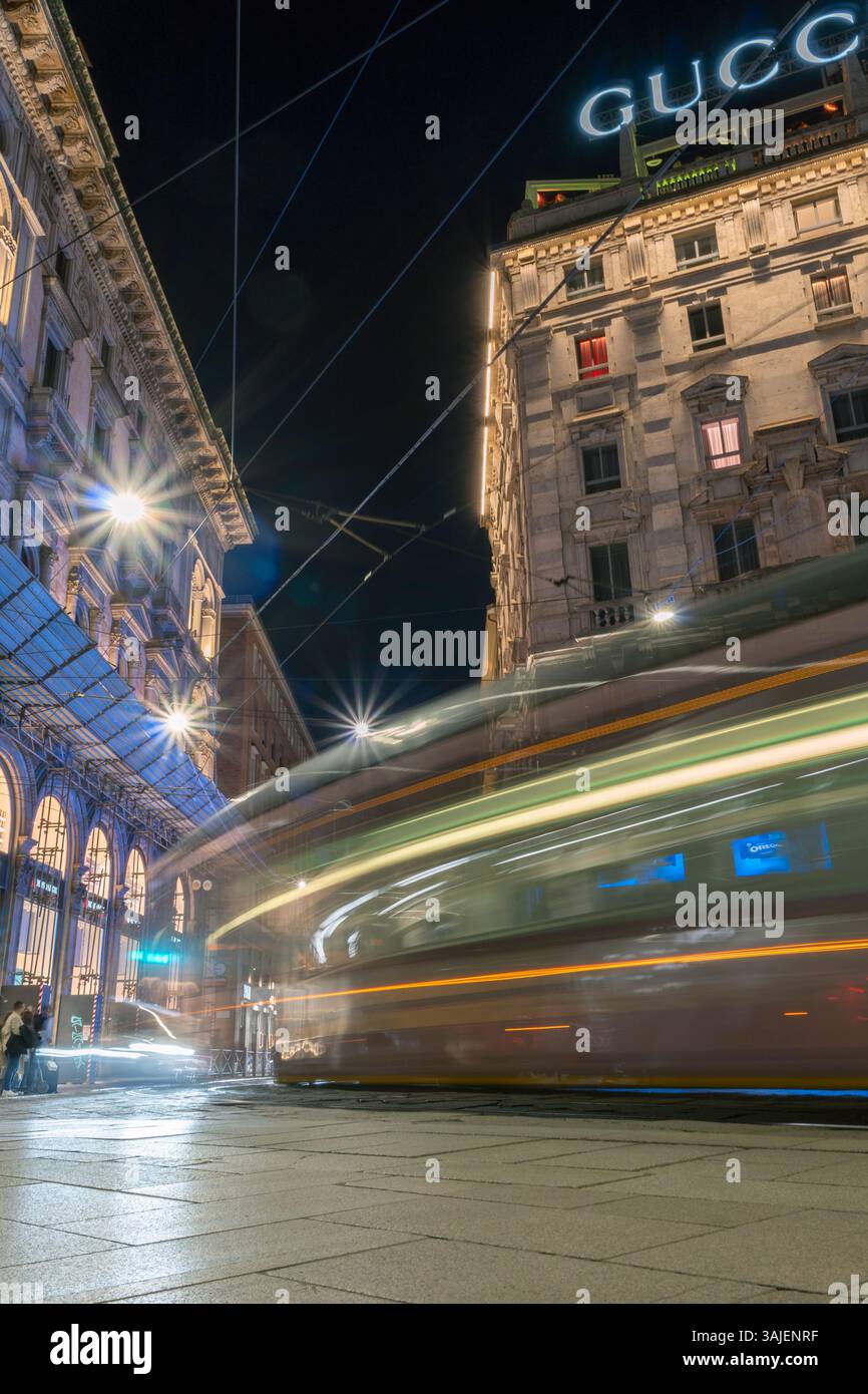Milan, Italy - April 3, 2025: Busy street at night in Milan, Italy ...