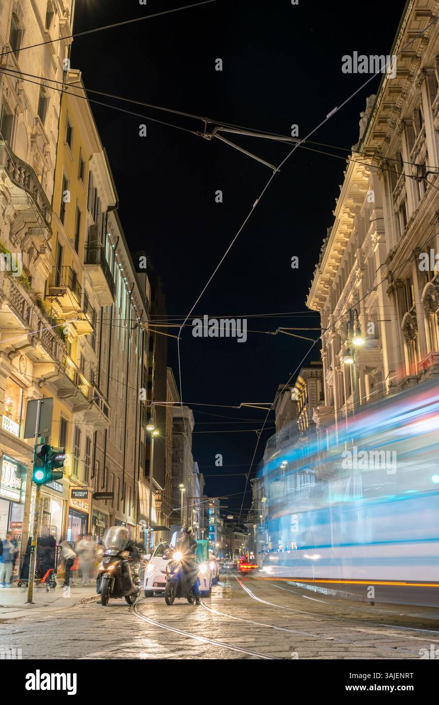 Milan, Italy - April 3, 2025: Busy street at night in Milan, Italy ...