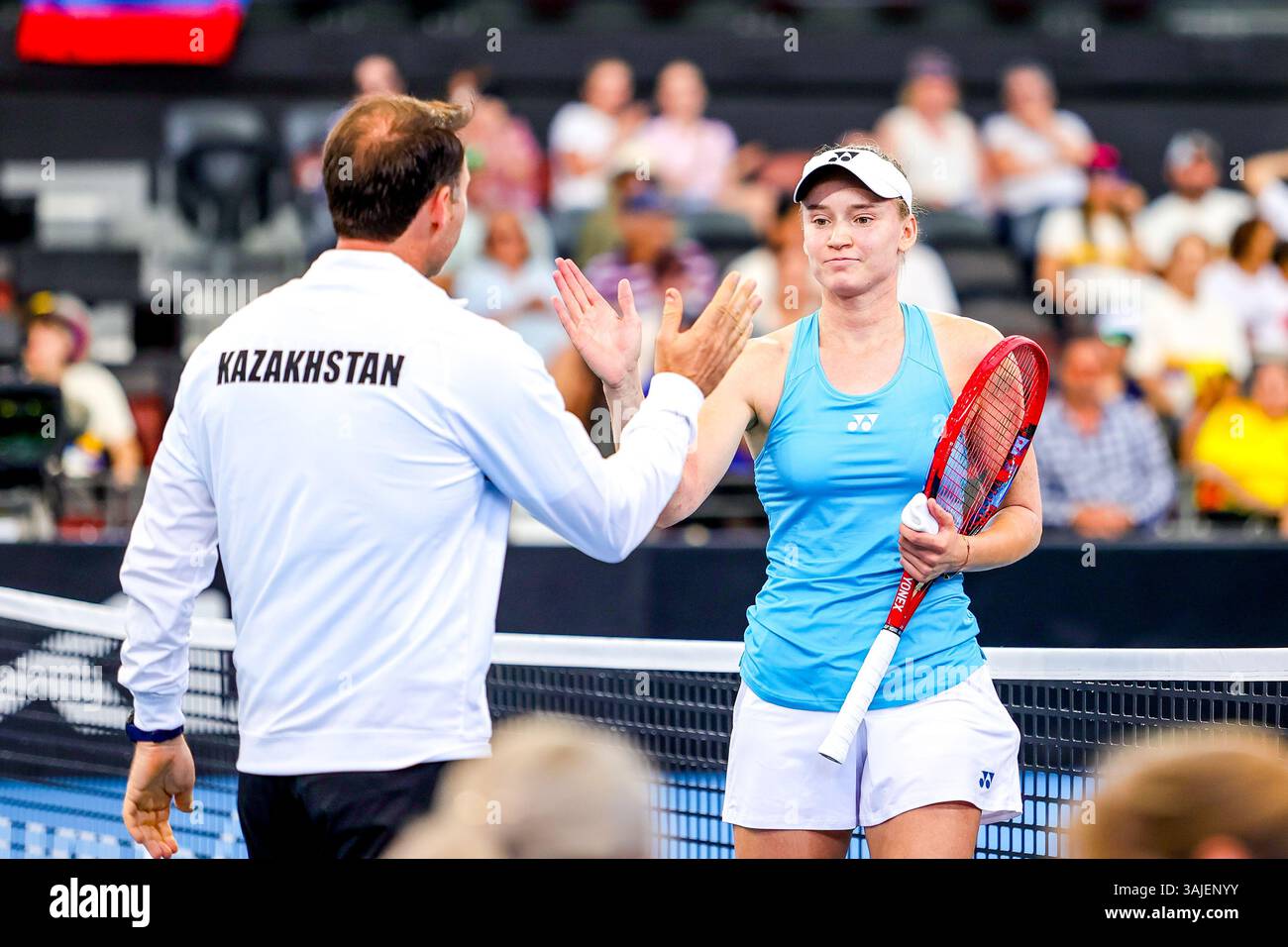 Elena Rybakina (Kazakhstan) is congratulated by the Team Captain after ...