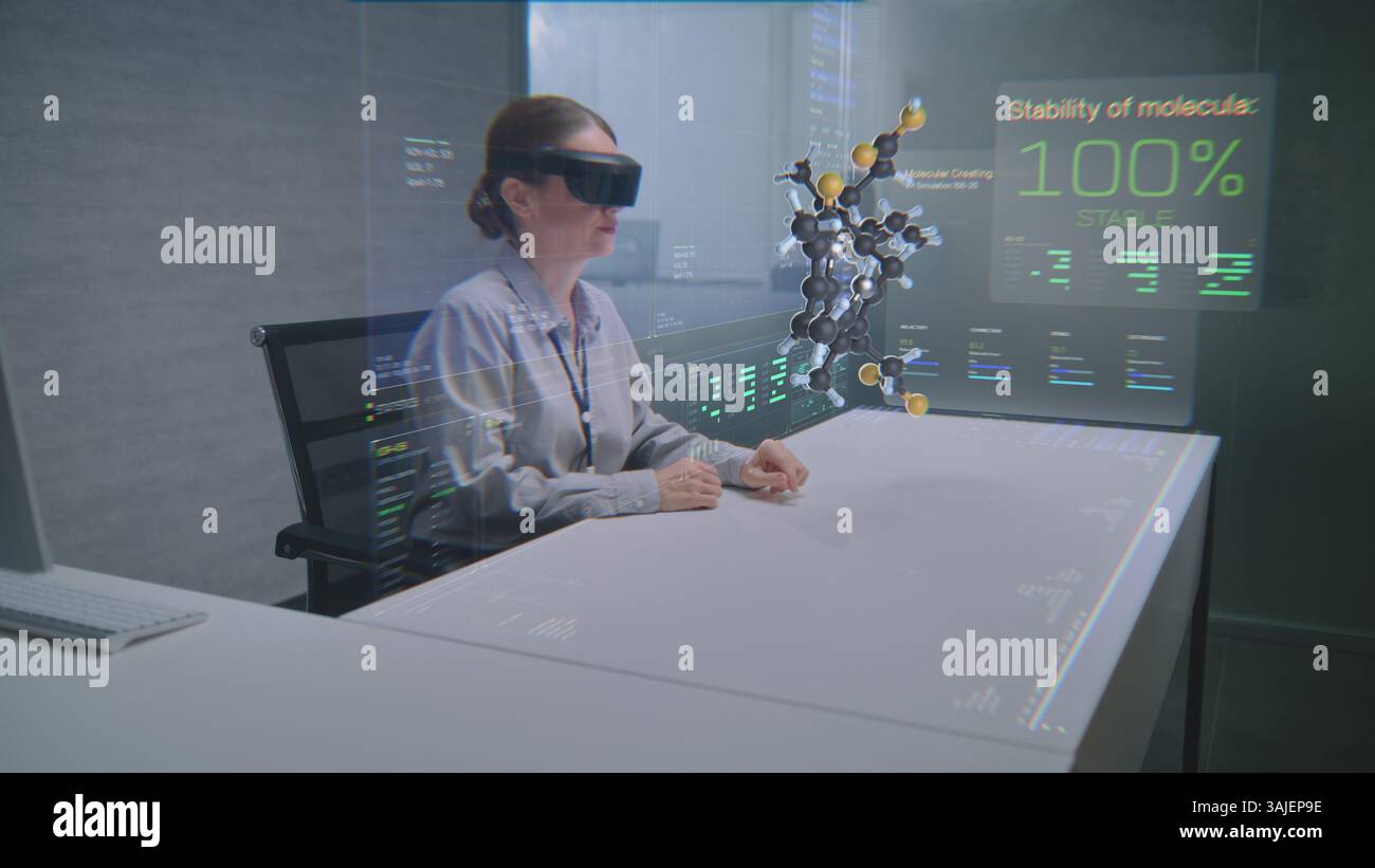 Female Professional Uses Augmented Reality Headset to Visualize 3D Hologram of Molecular ...