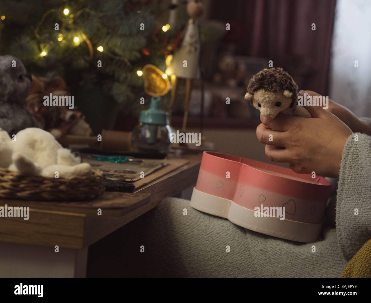Hands Stuffing a Teddy Hedgehog with Sawdust Stock Photo - Alamy