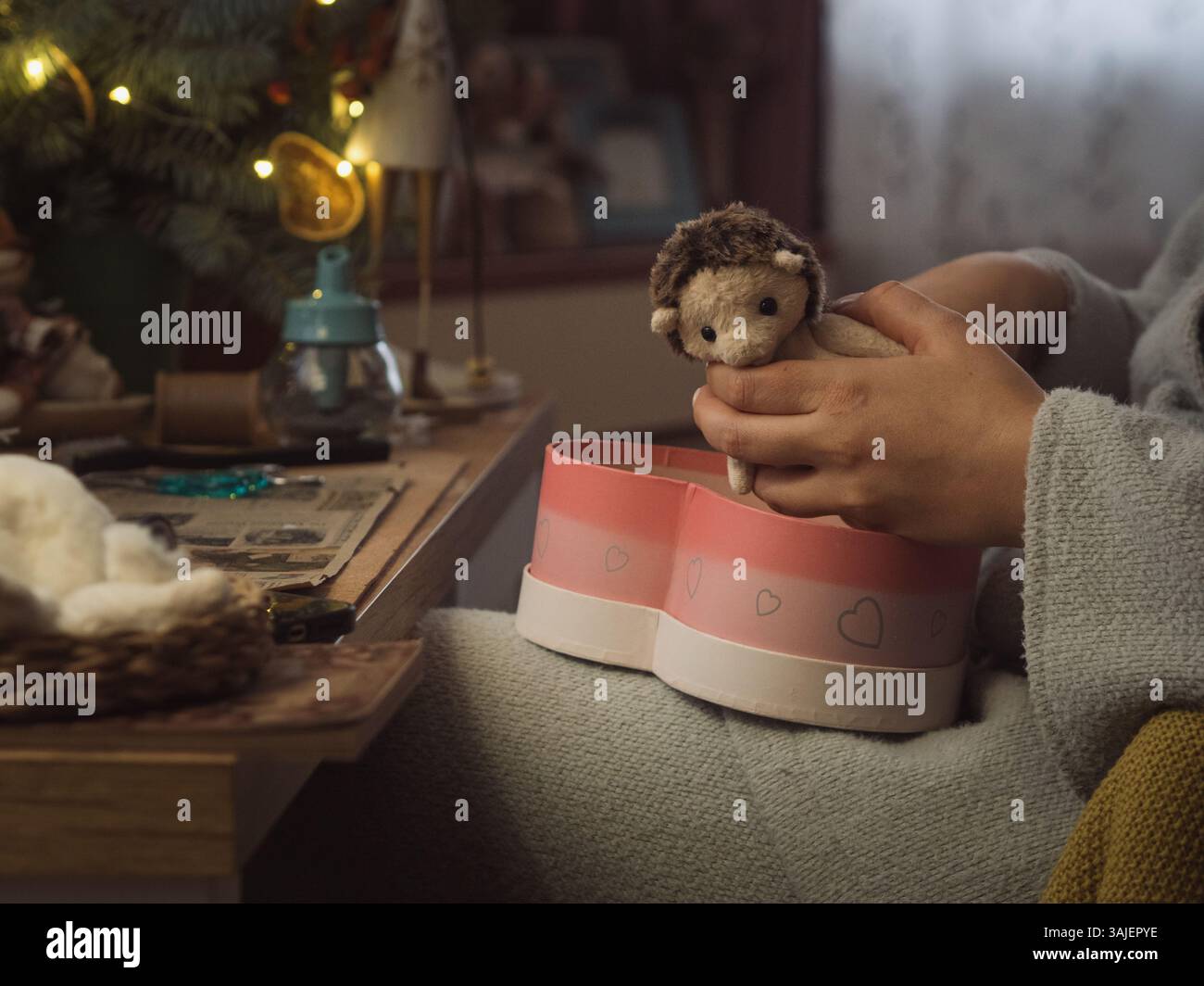 Hands Stuffing a Teddy Hedgehog with Sawdust Stock Photo - Alamy