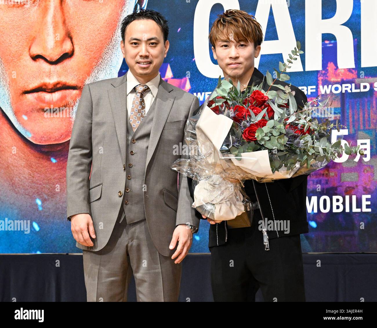 Undisputed super-bantamweight world champion Naoya Inoue, right, poses with Yosuke Ishibashi ...