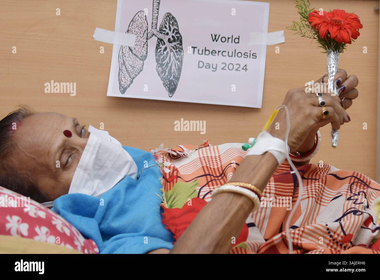 TB (Tuberculosis) patients are holding flowers and sweets given by ...