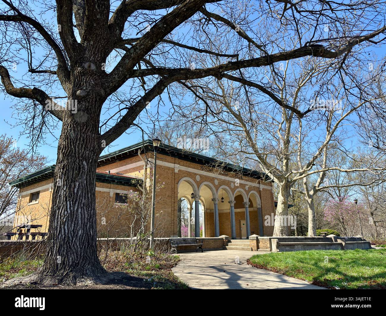Historic brick pavilion with arched columns in early spring park Stock ...