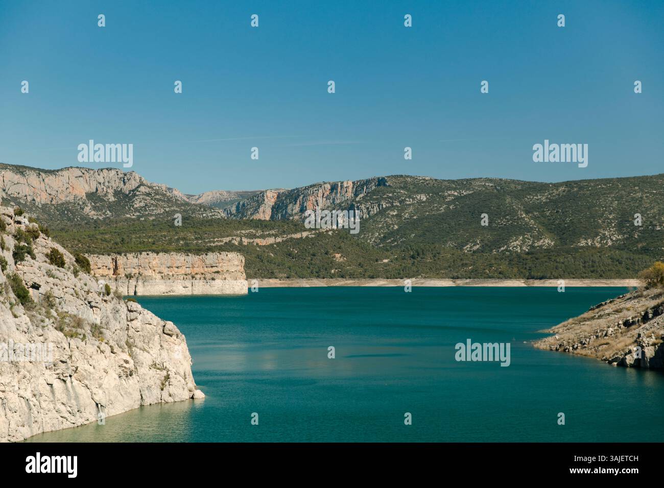 Mountain Reservoir with Turquoise Water and Cliffs Stock Photo - Alamy