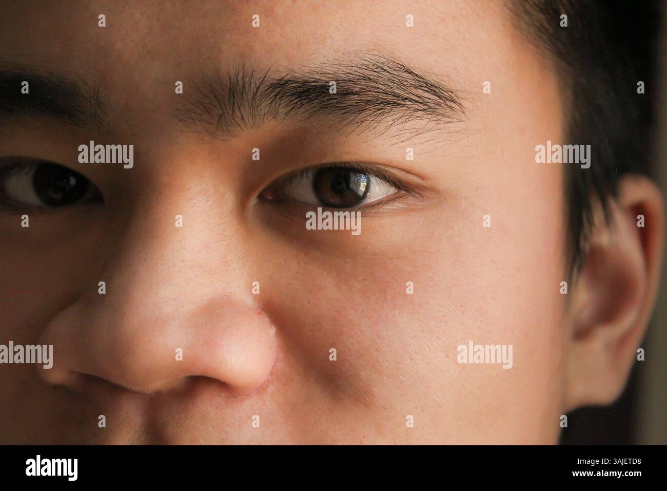 Portrait showing focused eyes and natural facial expression Stock Photo ...