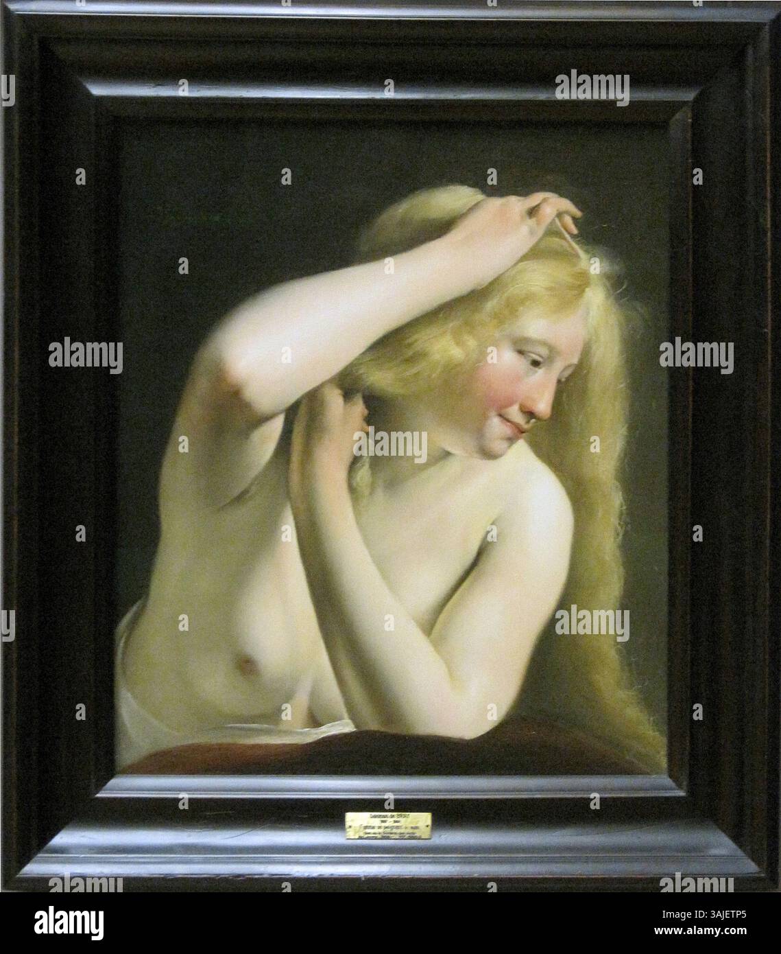 This 1630-1635 painting by Salomon de Bray shows a young woman combing her hair, an example of ...