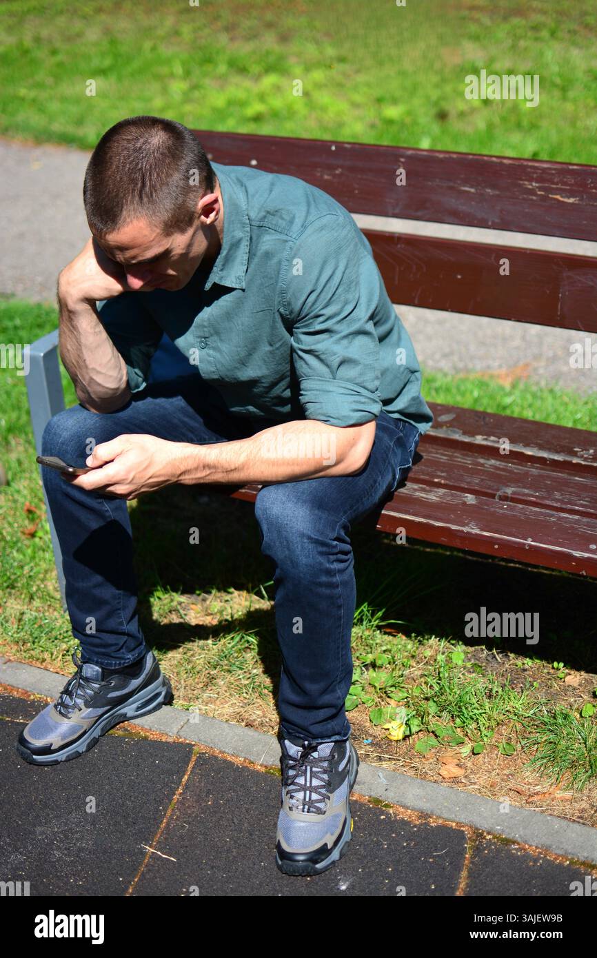 Guy hand scrolling phone green hi-res stock photography and images - Alamy