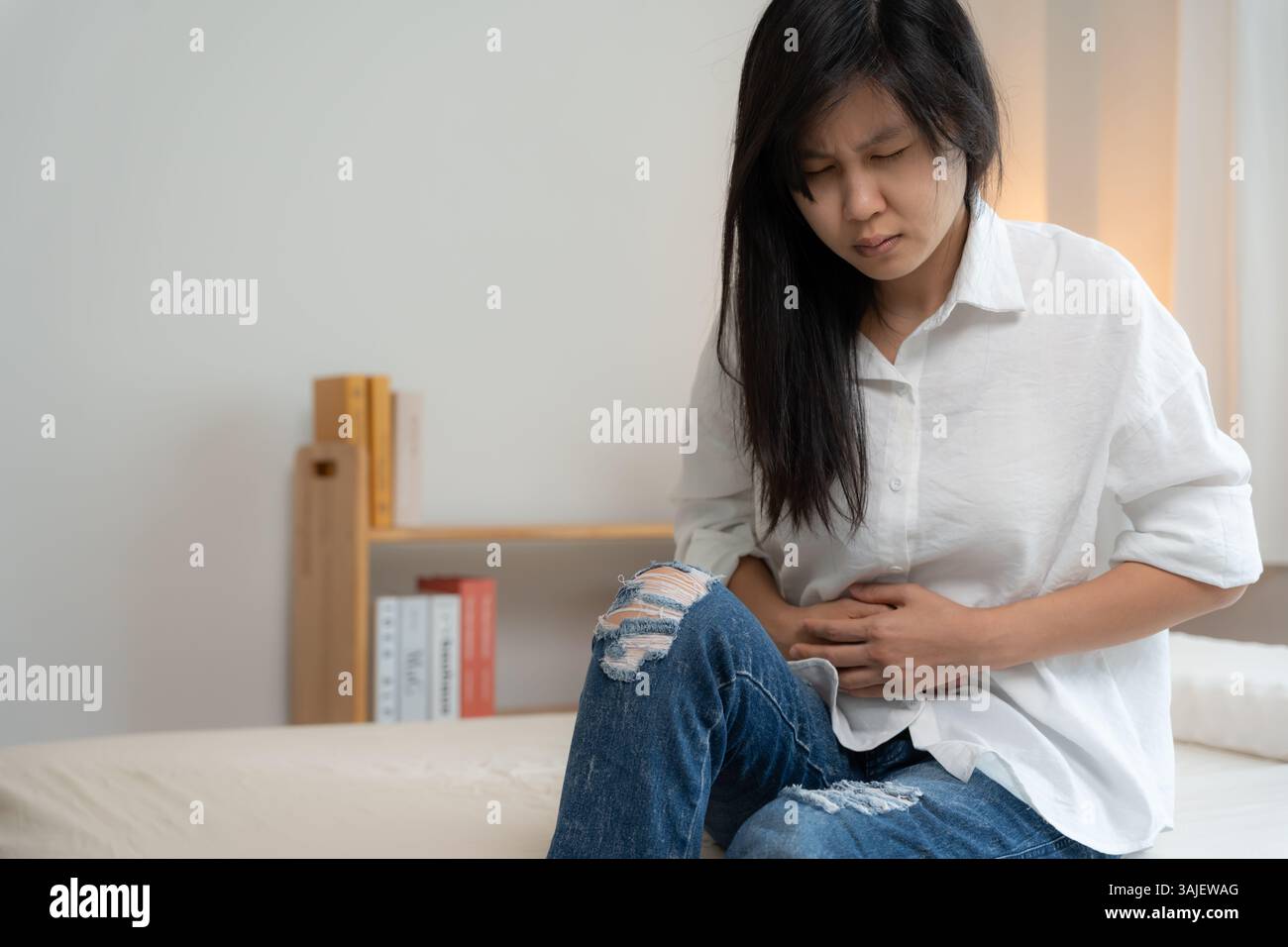 stomach ache. Asian women have abdominal pain, indigestion, gastritis ...