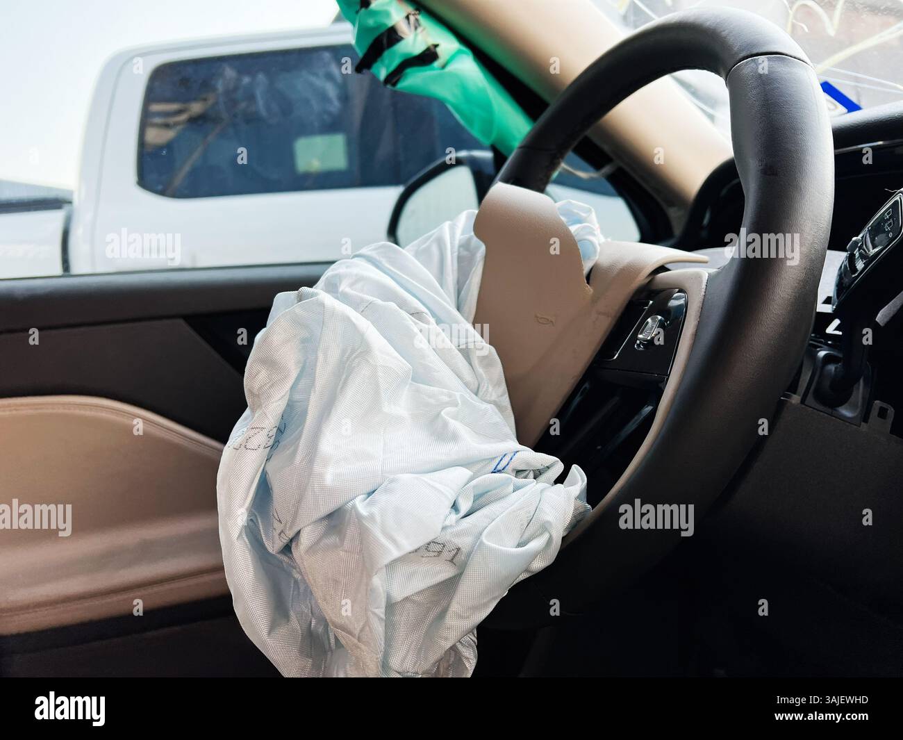 Interior view depicting an inflated airbag following an automobile ...