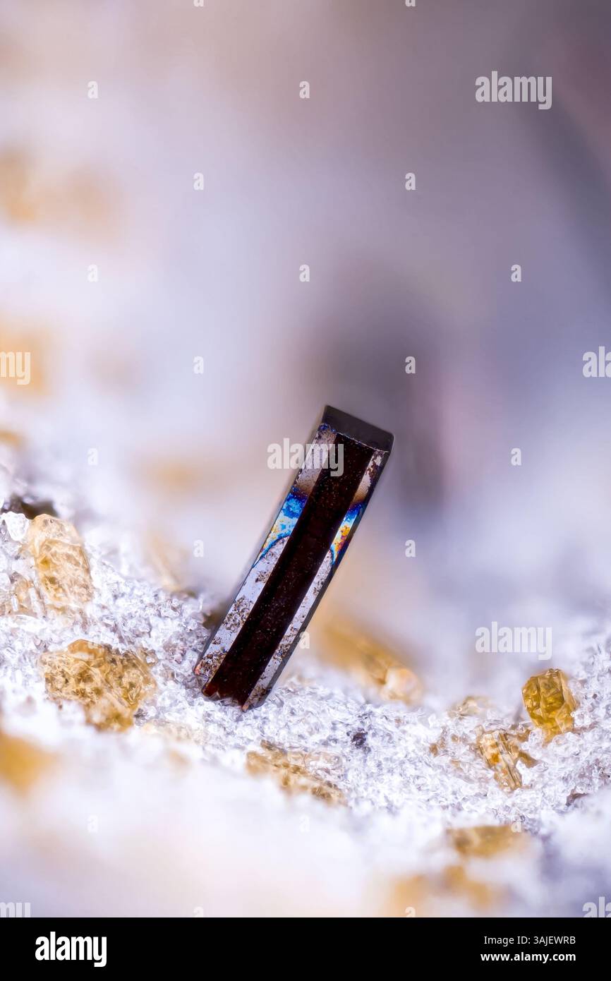 Dark Pseudobrookite crystals with yellow Enstatite. Specimen from ...