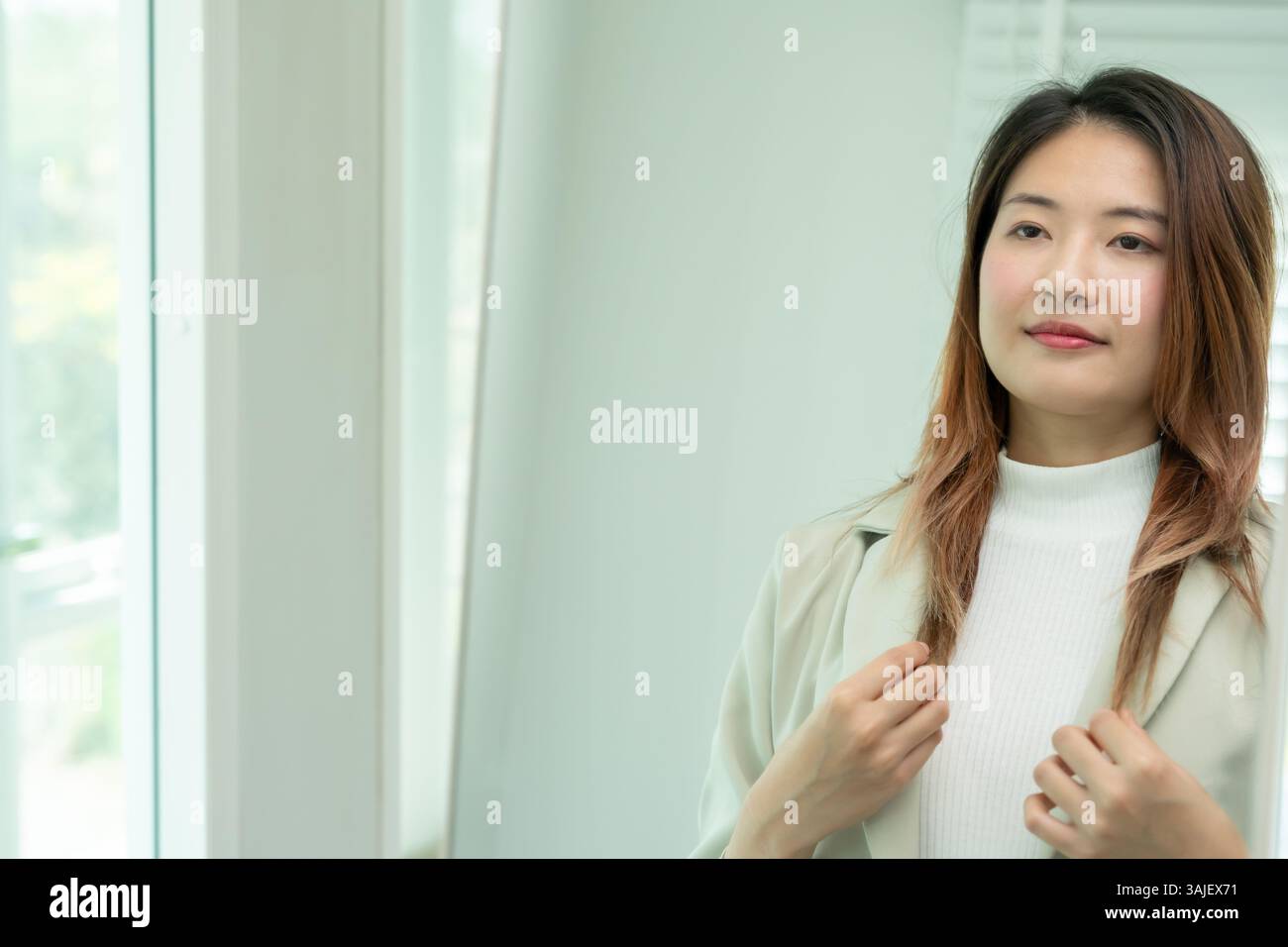 Beautiful woman preparing before job interview, building confidence ...
