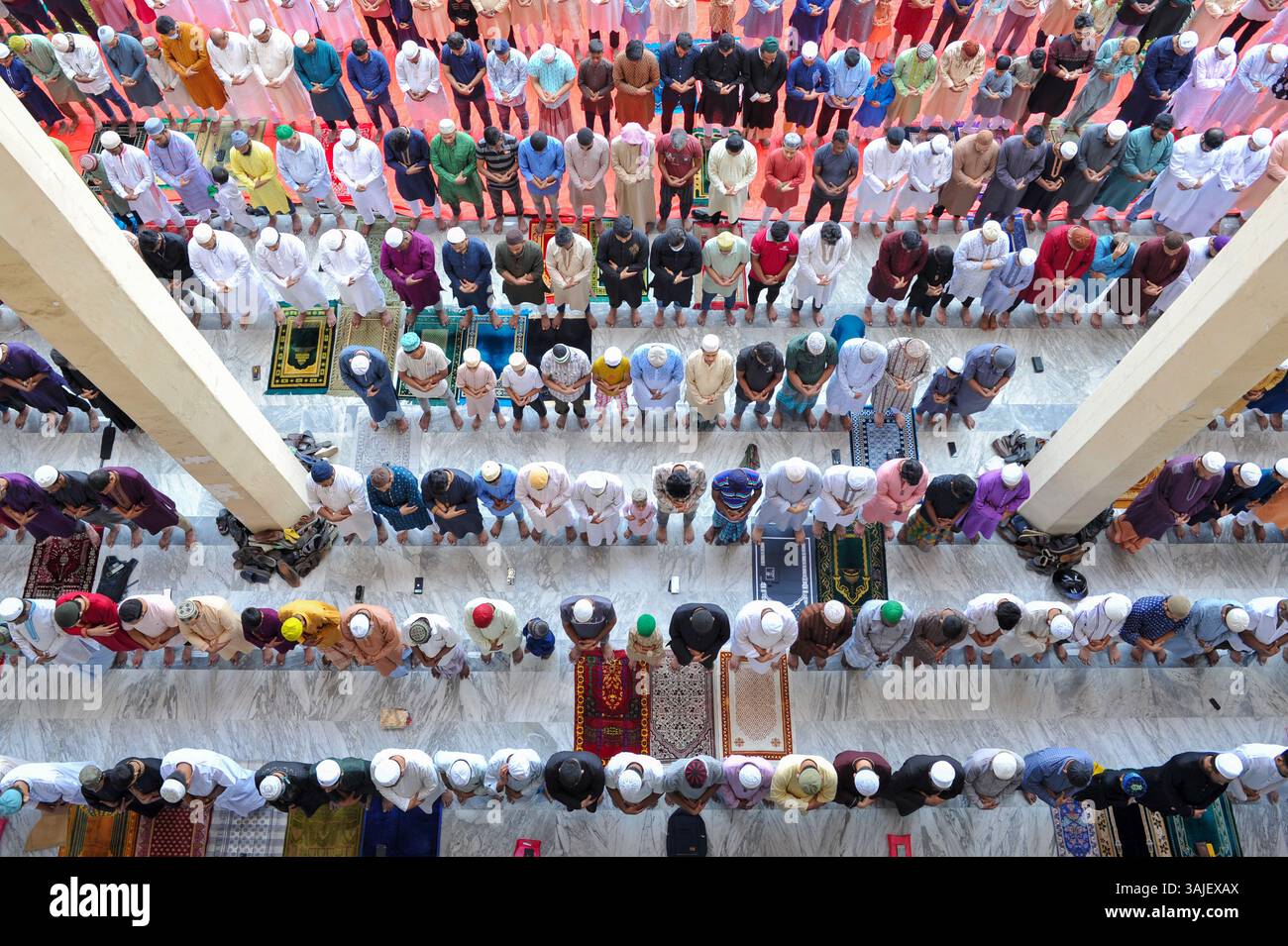 A Muslim attends Jumatul Bidah, the last friday prayer of the month of ...