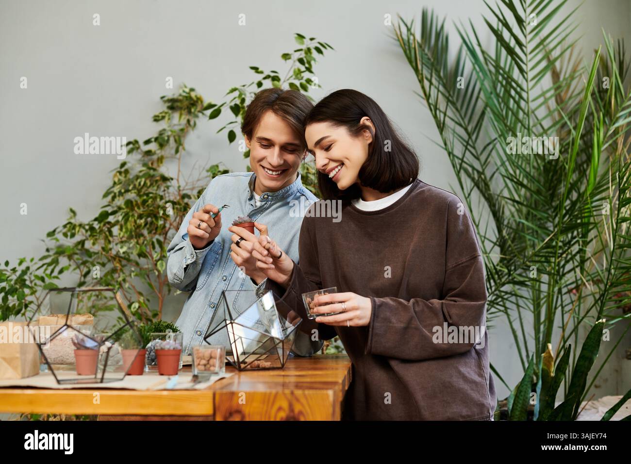 Loving couple engage in a joyful activity in an art studio, exchanging ...