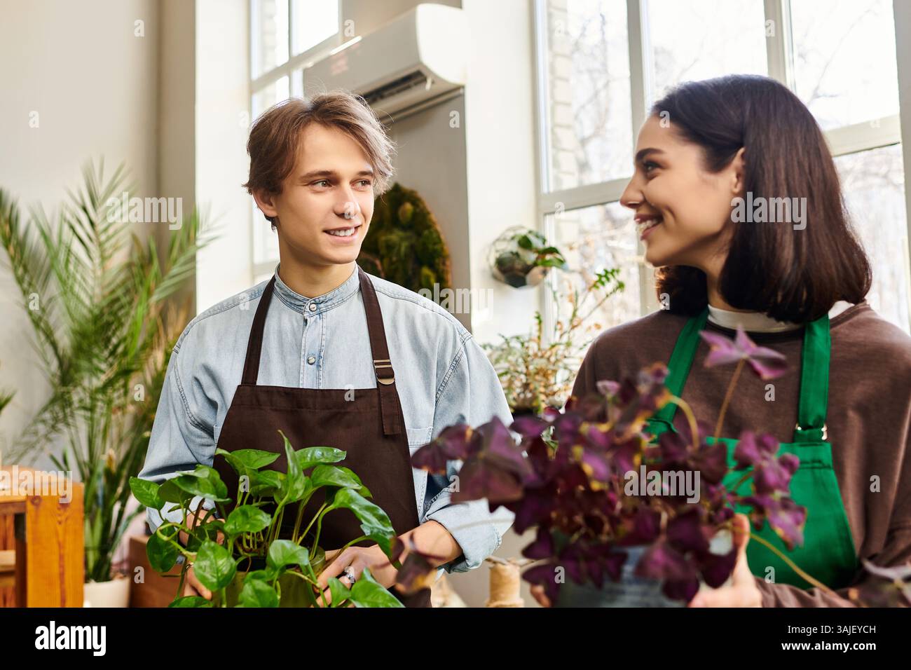 Creative couple engage in lively conversation while surrounded by ...