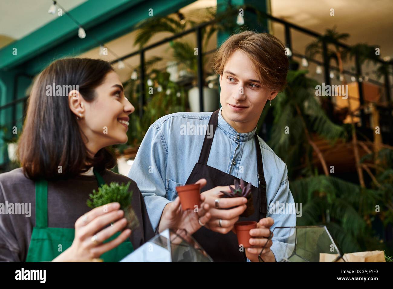 Creative couple collaborate on creative projects in a vibrant, green ...