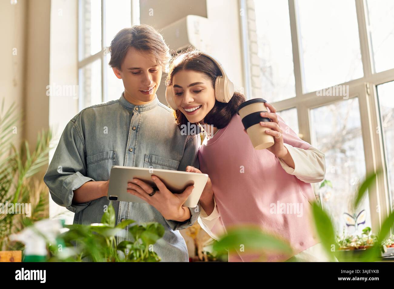 Creative couple engage joyfully, sharing ideas and inspiration while ...