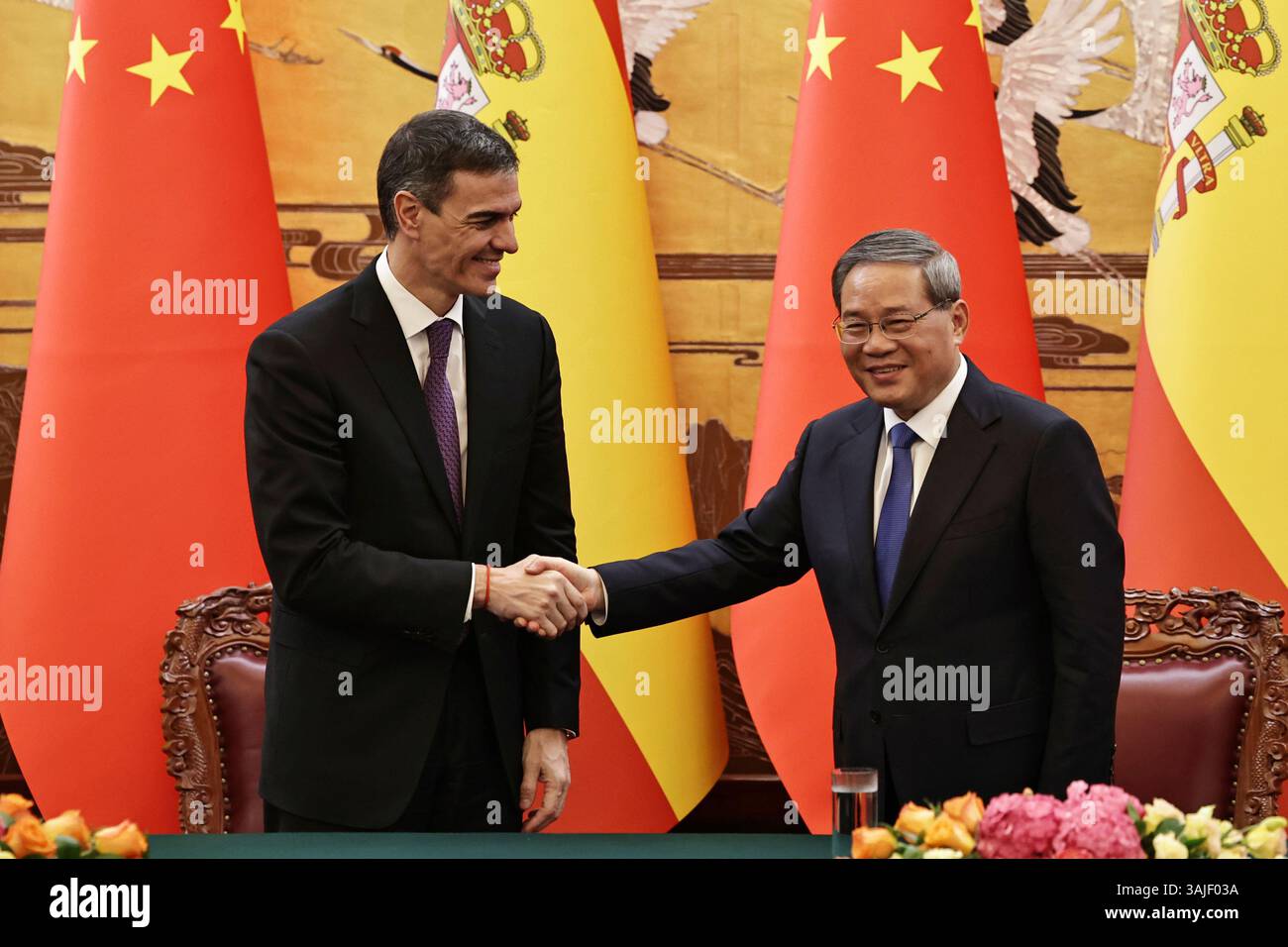 Spanish Prime Minister Pedro Sanchez, left and Chinese Premier Li Qiang ...