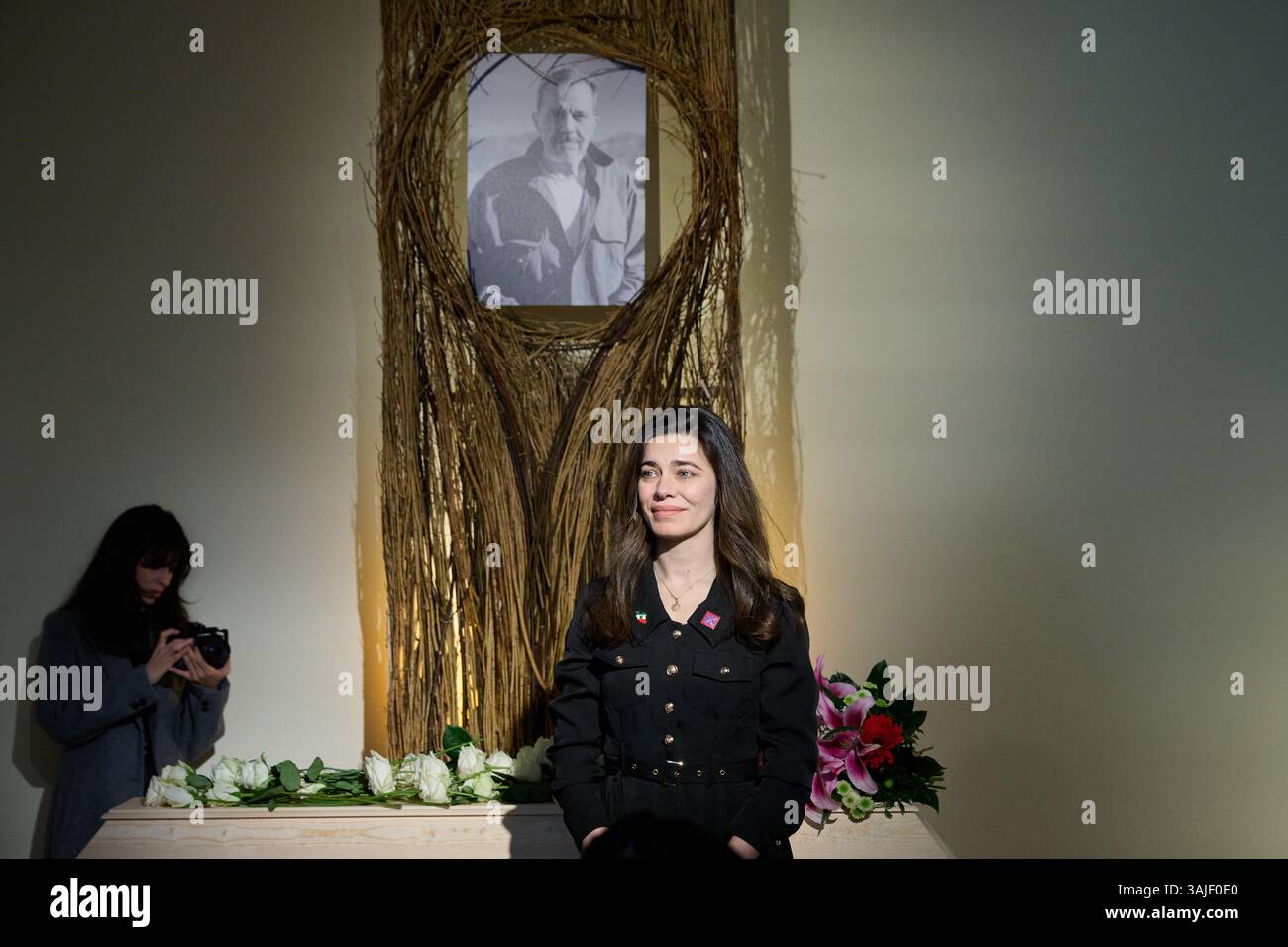 Berlin, Germany. 11th Apr, 2025. Gazelle Sharmahd stands by the coffin ...