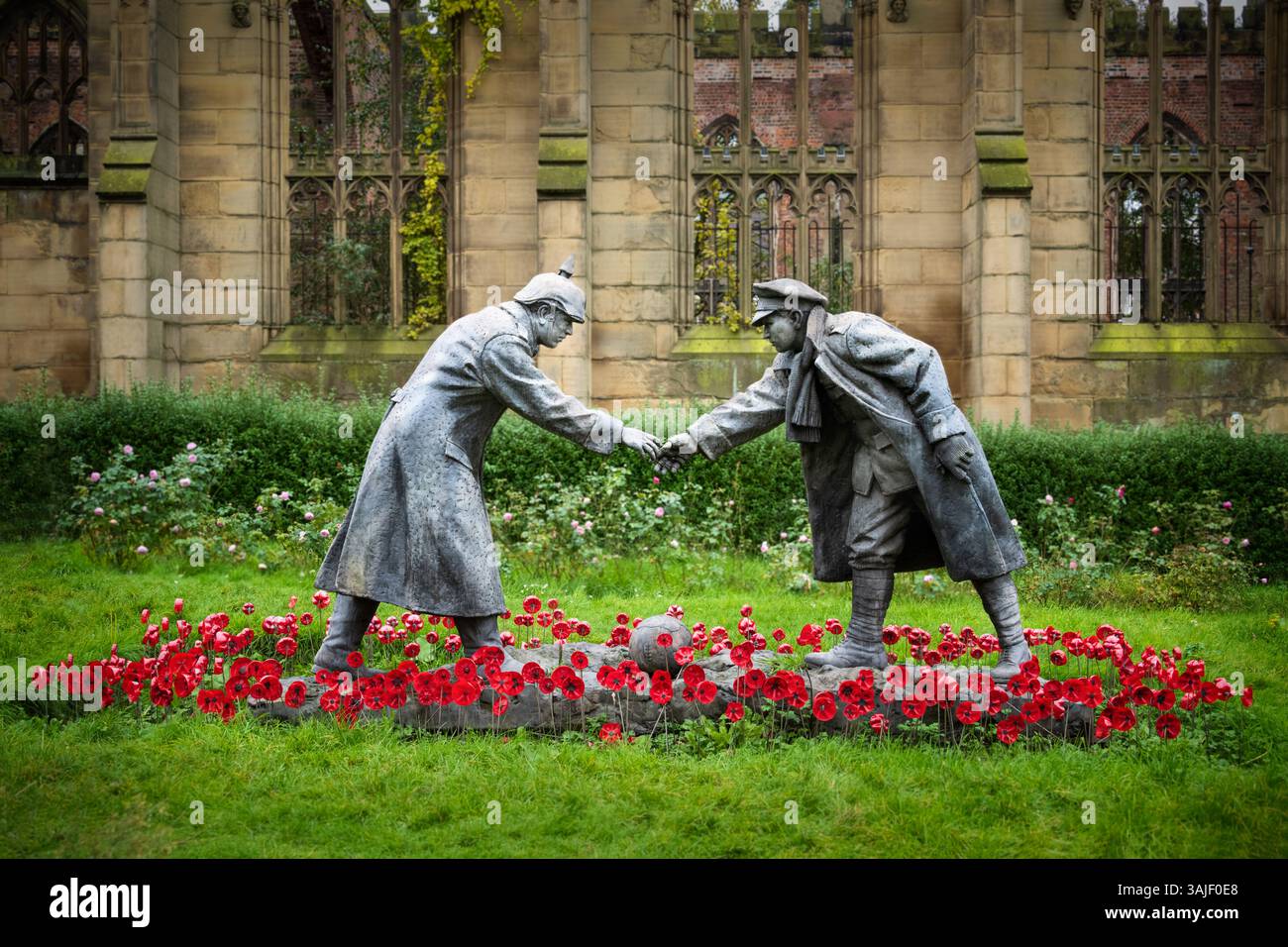 Statue of Soldiers Shaking Hands in Memorial Garden Stock Photo - Alamy