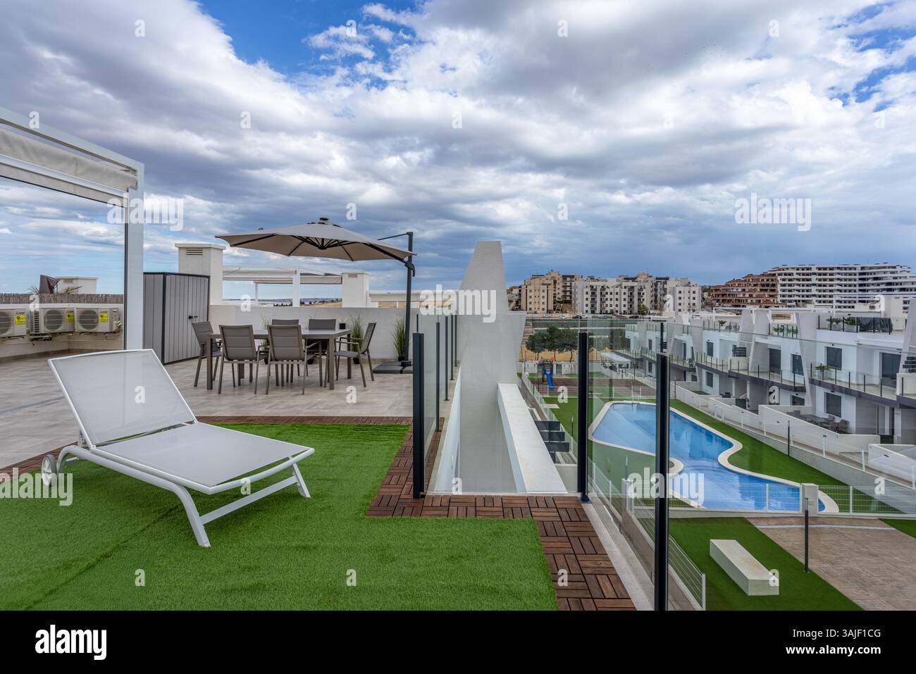 Rooftop view overlooking the swimming pool and modern residential ...