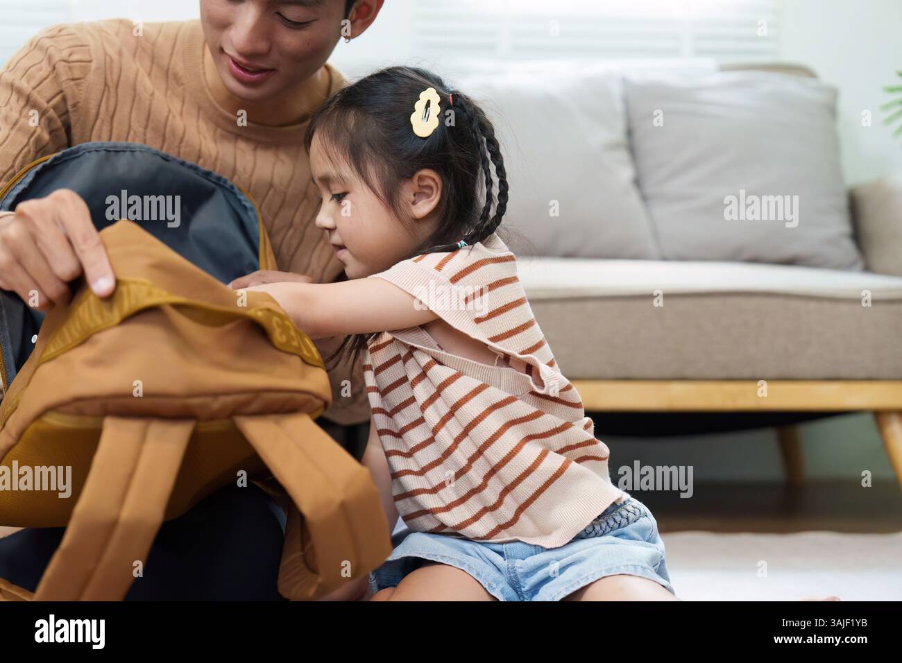 Back to School Preparation with Family. A father and daughter sorting ...
