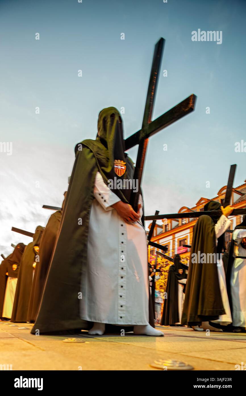 During Holy Week in Seville, penitents from the Hermandad de Santa ...