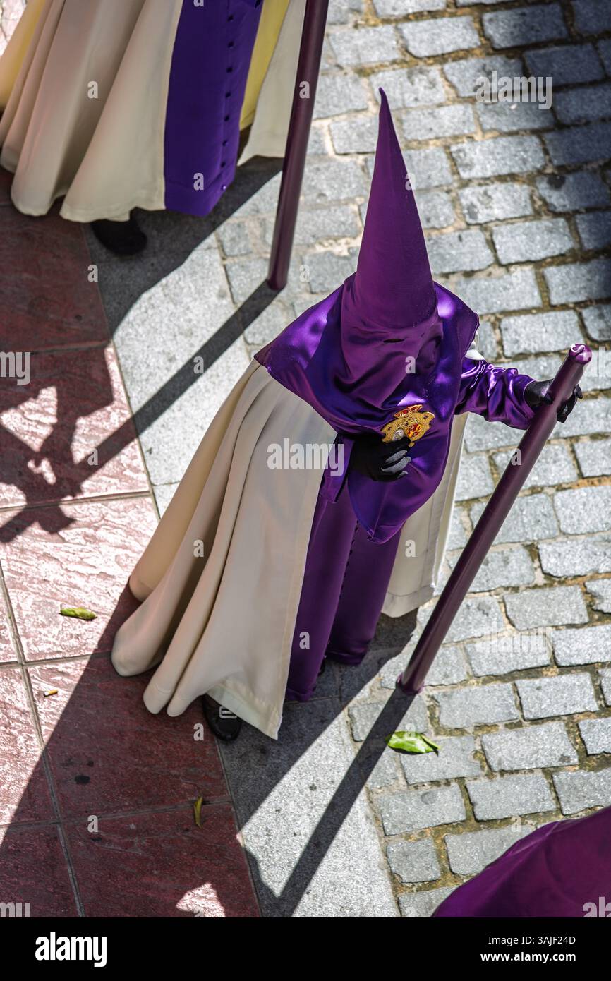 Traditional Holy Week attire worn during a religious procession in ...