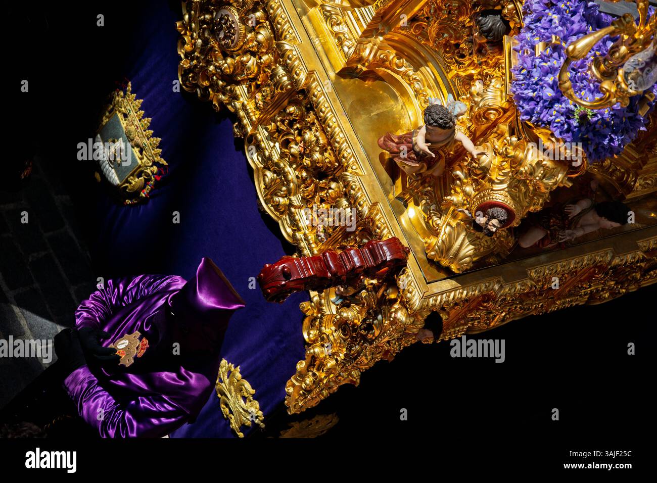 Historical Holy Week celebration featuring a penitent and the ...