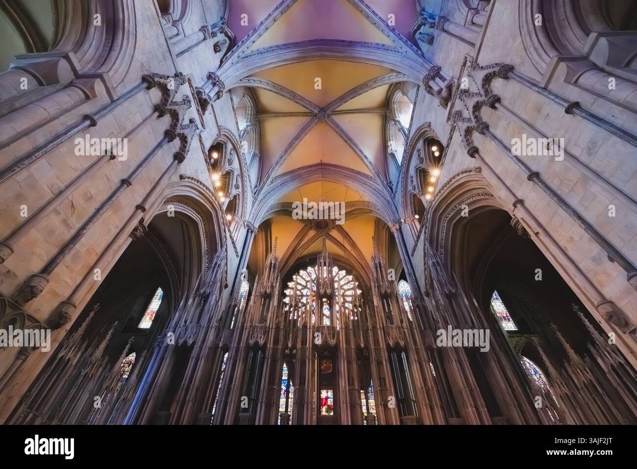 The ornate interior of Durham Cathedral features a grand altar, vaulted ...