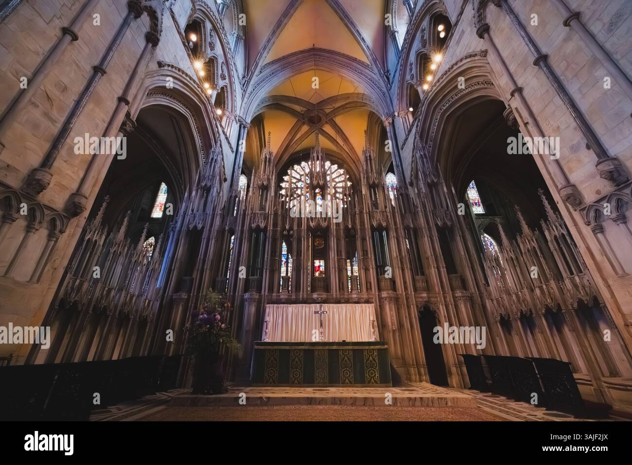 The ornate interior of Durham Cathedral features a grand altar, vaulted ...