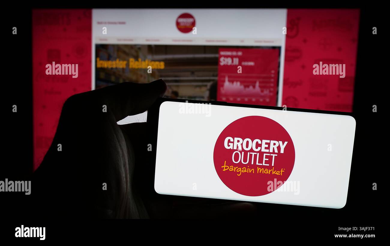 In this photo illustration, a mobile phone with the logo of American ...