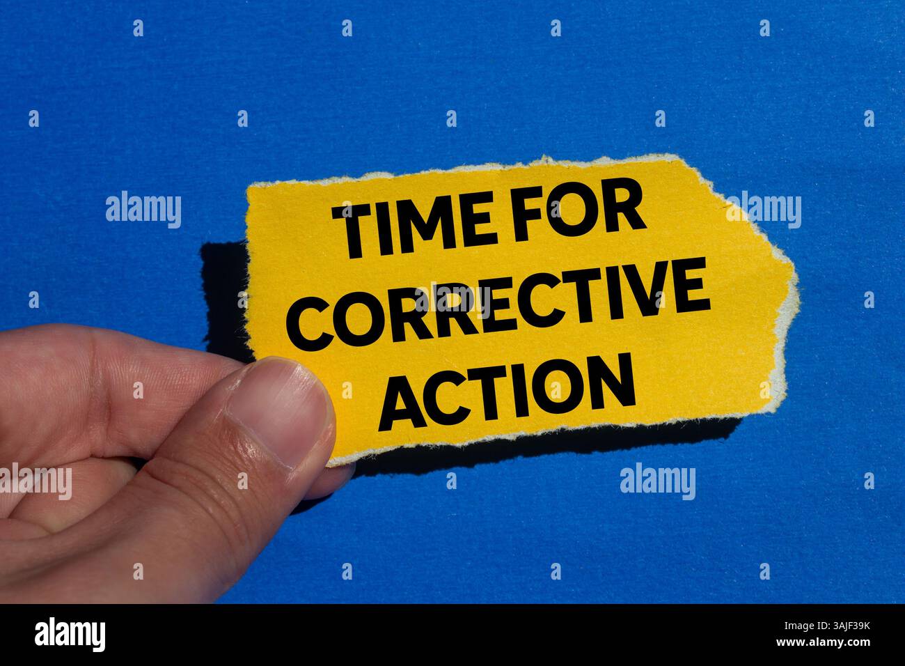 Time for corrective action message written on ripped torn yellow paper ...