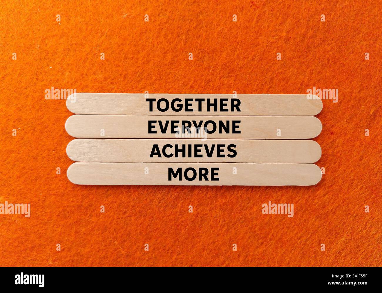Together everyone achieves more message written on wooden sticks on ...