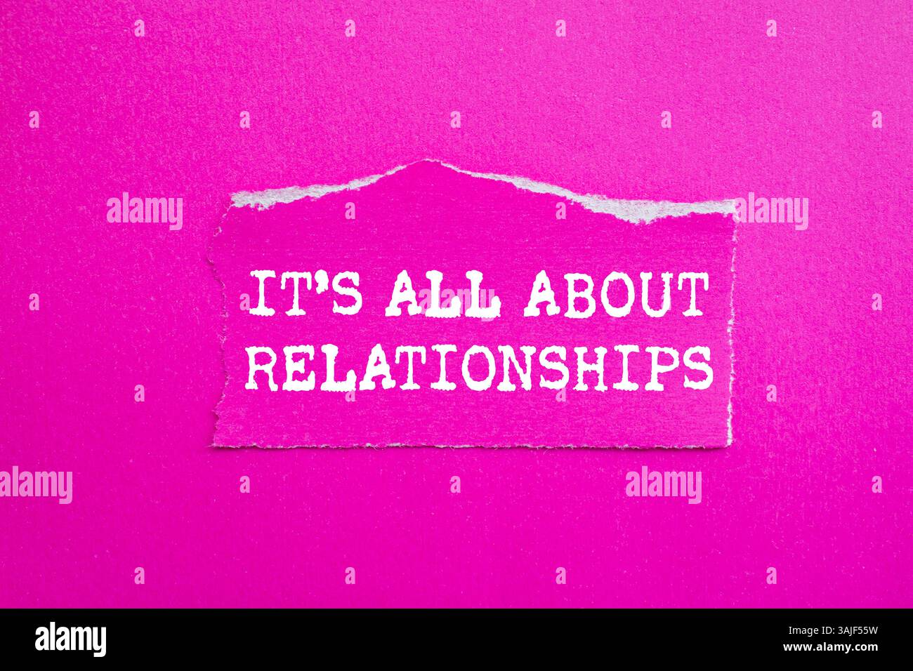 It’s all about relationships message written on ripped torn pink paper piece on pink background ...