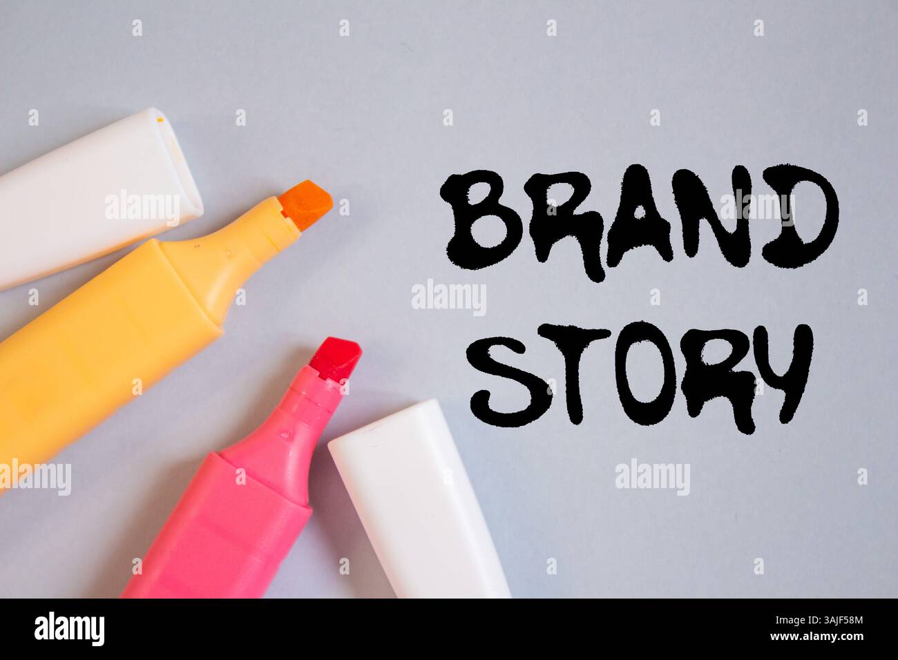 Brand story message written on grey background with colorful marker ...