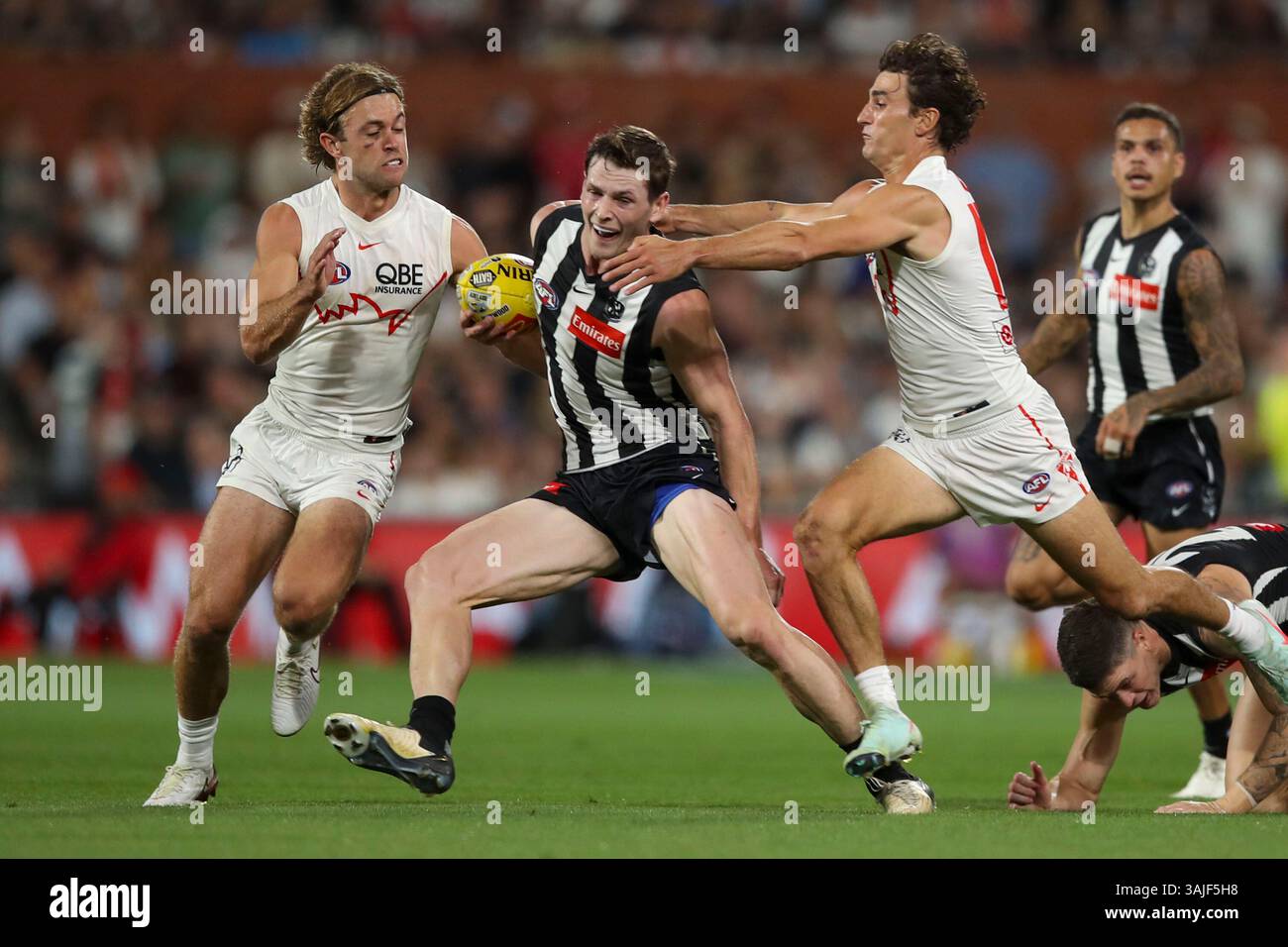 Adelaide, Australia. 11th Apr, 2025. Ned Long of the Magpies is tackled ...