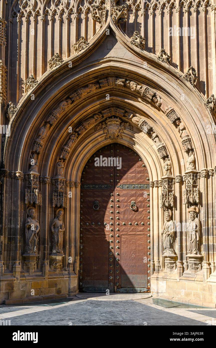 Ancient entrance door with stone decorations, part of the Cathedral ...