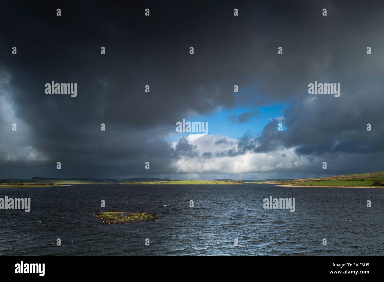 Dark ominous storm clouds gathering over Colliford Lake on the ...