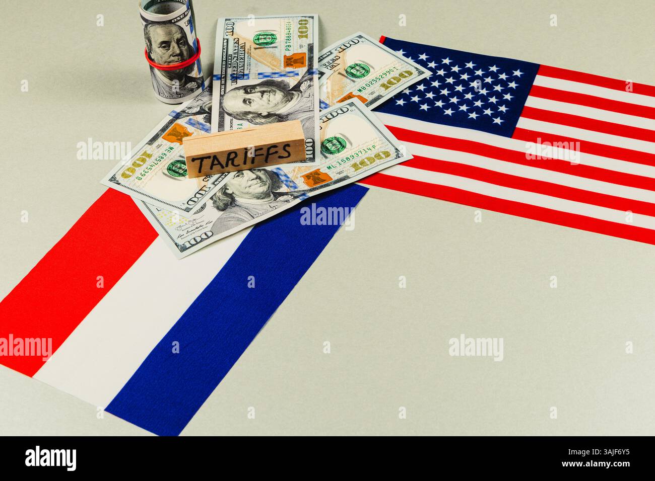 Currency notes surround flags of France and the USA, highlighting ...
