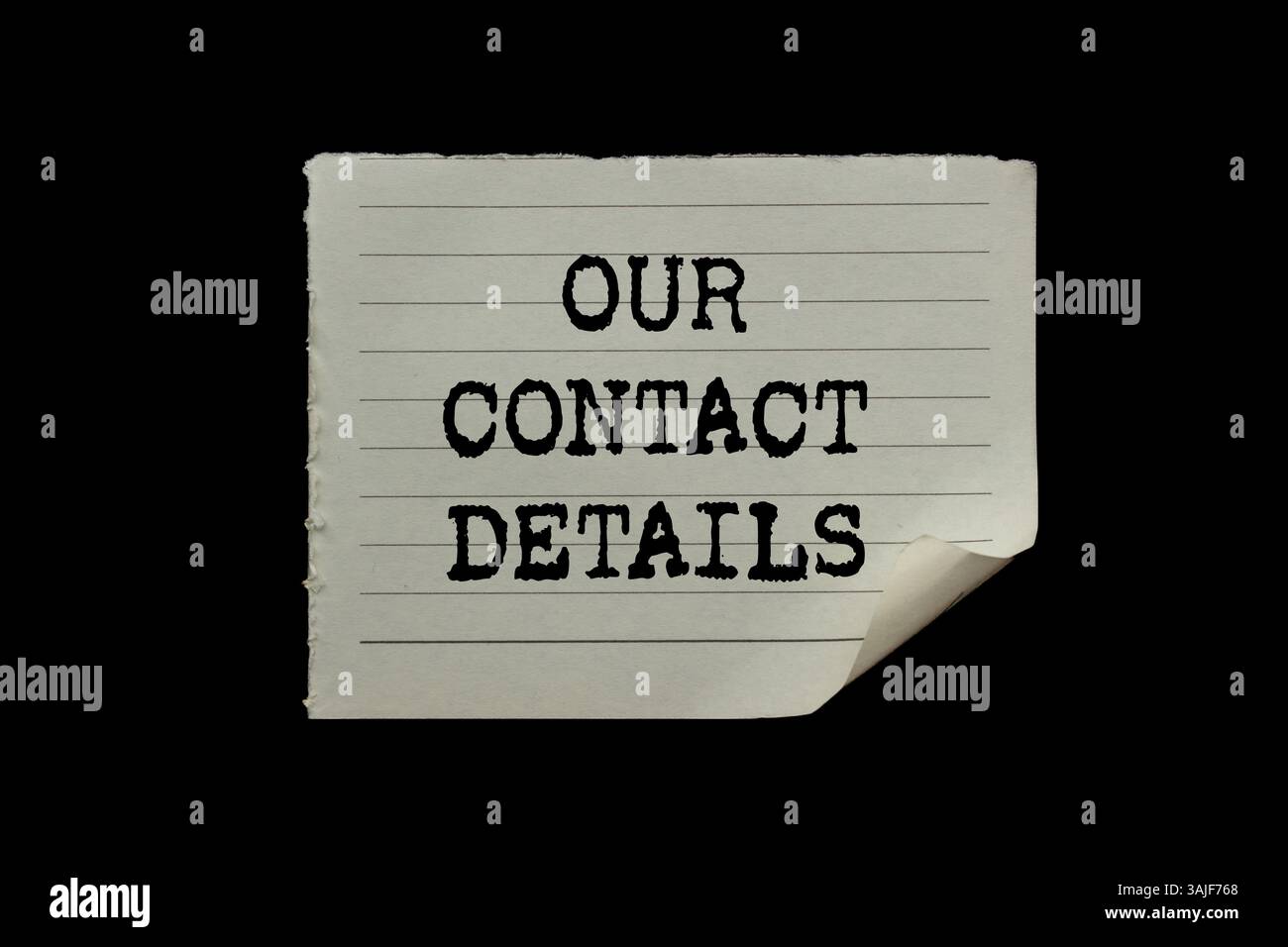 Our contact details message written on ripped torn paper piece on black background. Conceptual ...