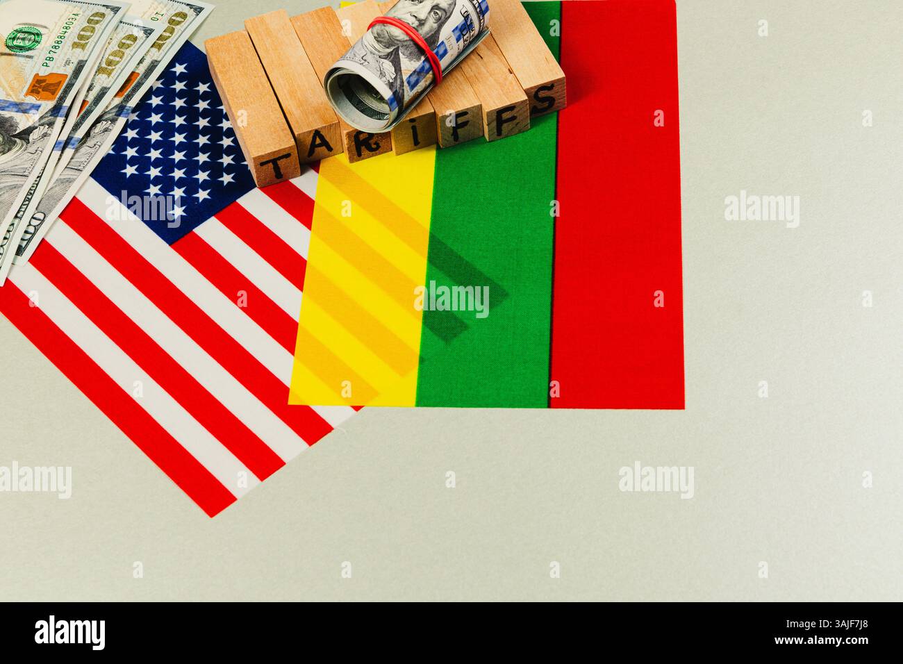 Currency, national flags of the USA and Mali, and letters spelling ...