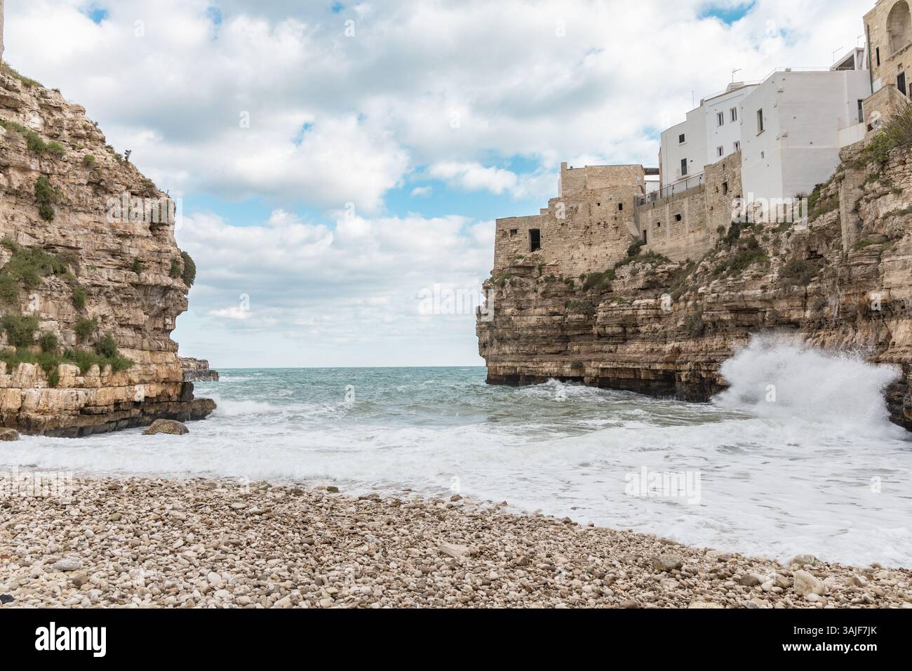 A stunning view of Lama Monachile beach in Polignano a Mare, Puglia ...