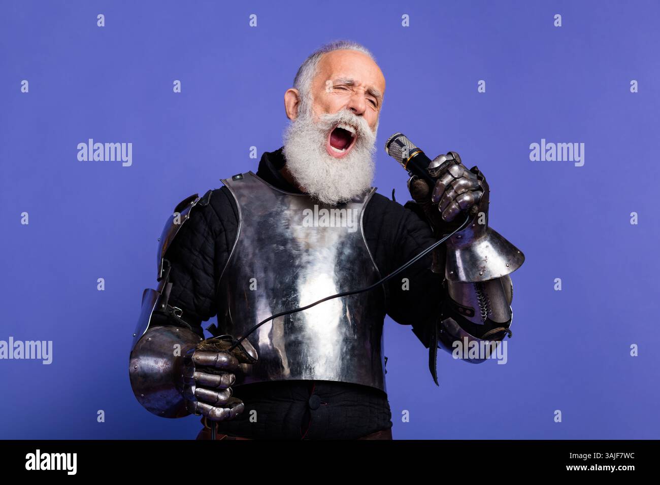 Elderly man in knight armor singing passionately against vivid purple ...