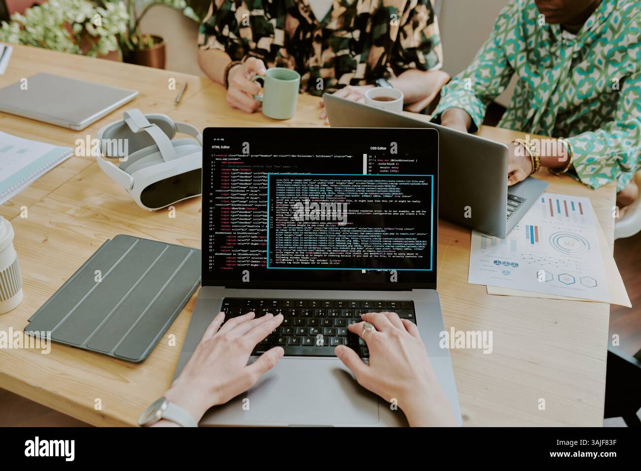 High angle shot of unrecognizable delicate hands typing codes on laptop ...