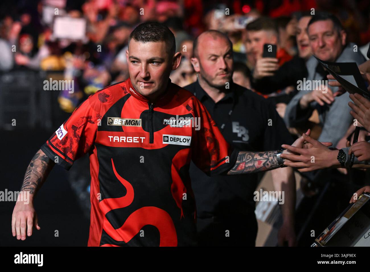 Nathan Aspinall walks on during the Darts 2025 BetMGM Premier League ...