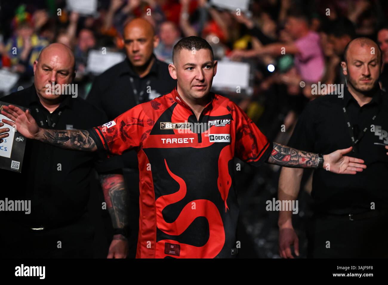 Nathan Aspinall walks on during the Darts 2025 BetMGM Premier League ...