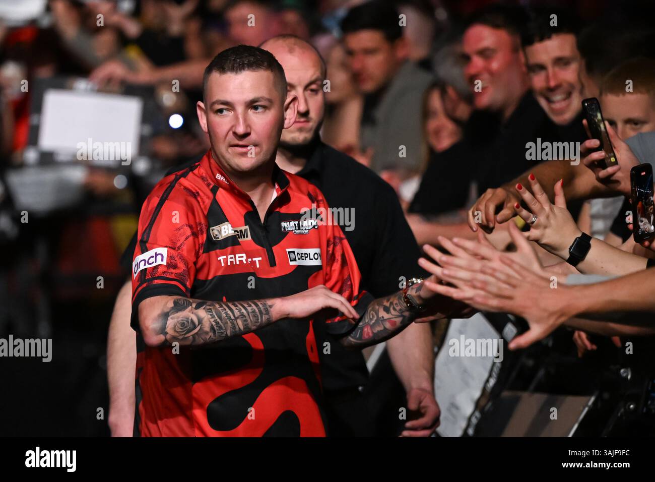 Nathan Aspinall walks on during the Darts 2025 BetMGM Premier League ...